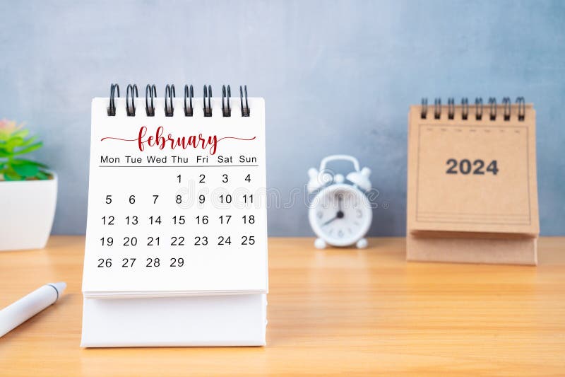 Front View of February Desk Calendar for 2024 Year and Alarm Clock with ...