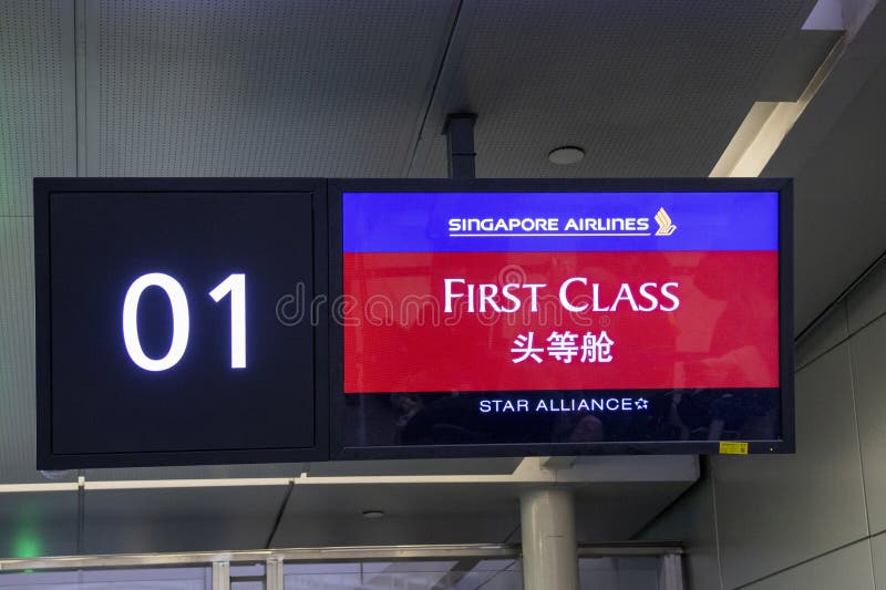 Front View Of First Class Sign At The Check In Counter In Pudong Airport Shanghai Editorial