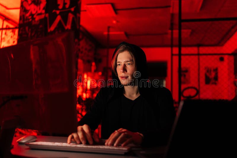 Front View of Focused Hacker Man in Black Sweatshirt Using Laptop and ...
