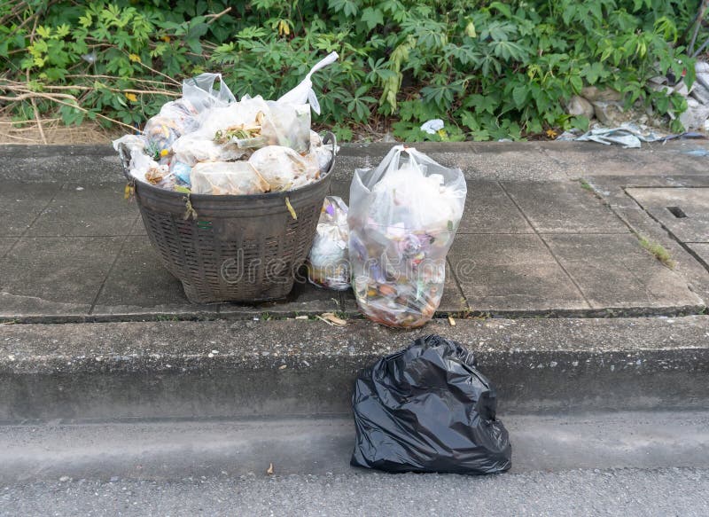 Front View of Garbage in Black Plastic Bag at Garbage Dump on Roadside ...