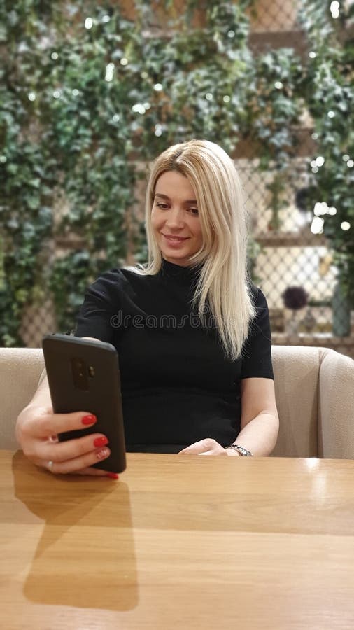 A Front View on a Girl Looking at the Mobile Stock Image - Image of ...