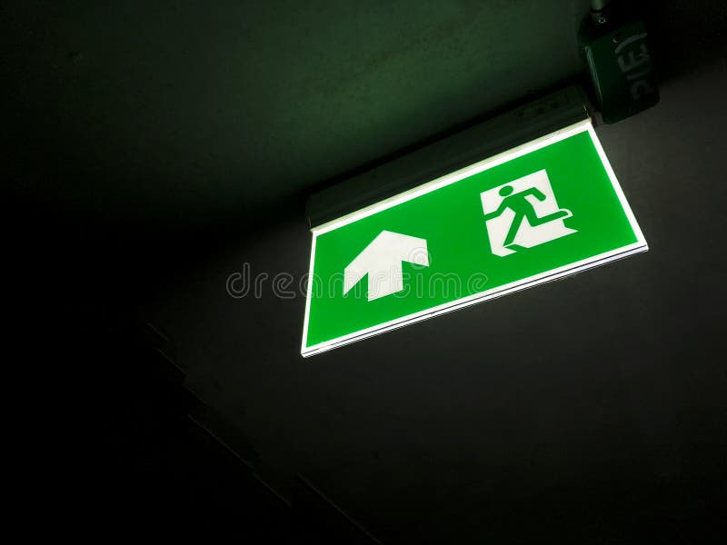 Front View of the Green Exit Sign in the Very Low Light Space. Stock ...