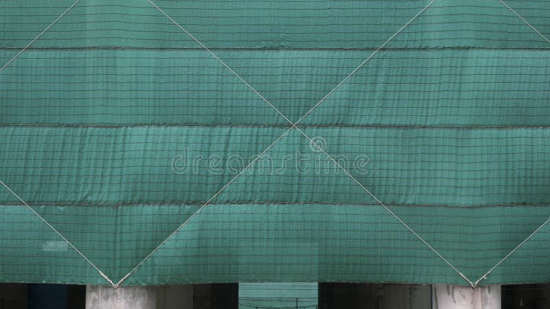 Green Mesh Sheets Covering Column of Large Building in Construction ...