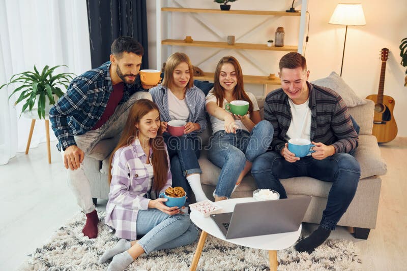 Front View. Group of Friends Have Party Indoors Together Stock Photo ...