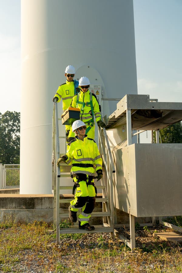 Front View Group of Wind Turbine or Windmill Workers or Technician Walk ...