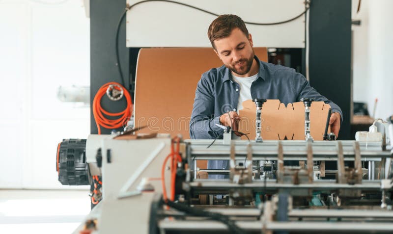 Front View. Handsome Man is Working at the Factory of Creating Eco ...