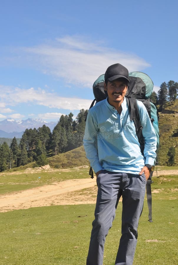 Front View of a Happy Young Guy Wearing Cap with Carrying Parachute ...