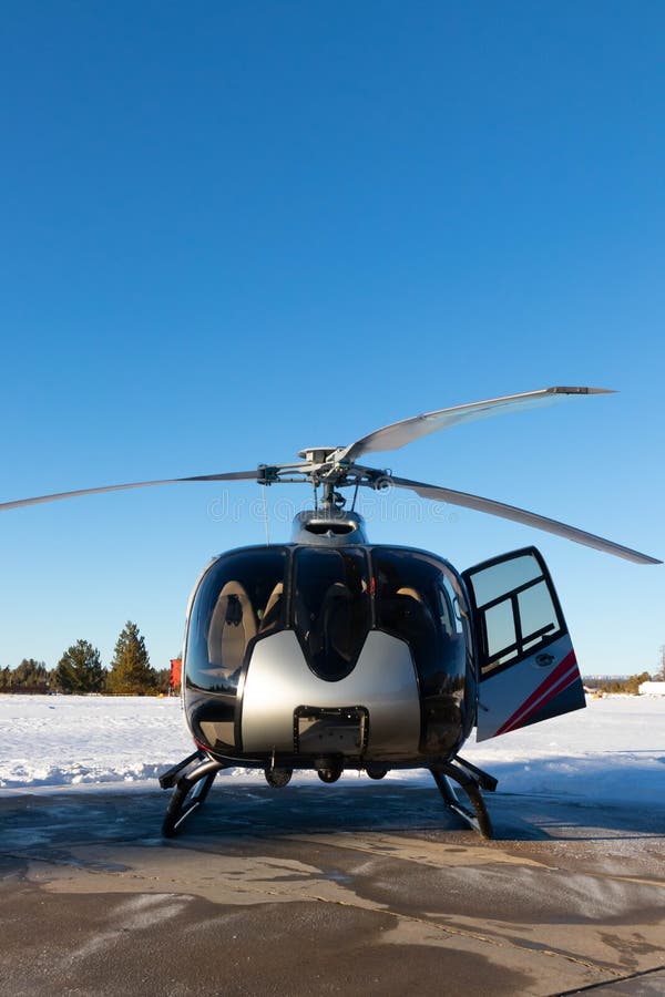Front View of Helicopter Surrounded by Snow with Blue Sky Stock Photo ...