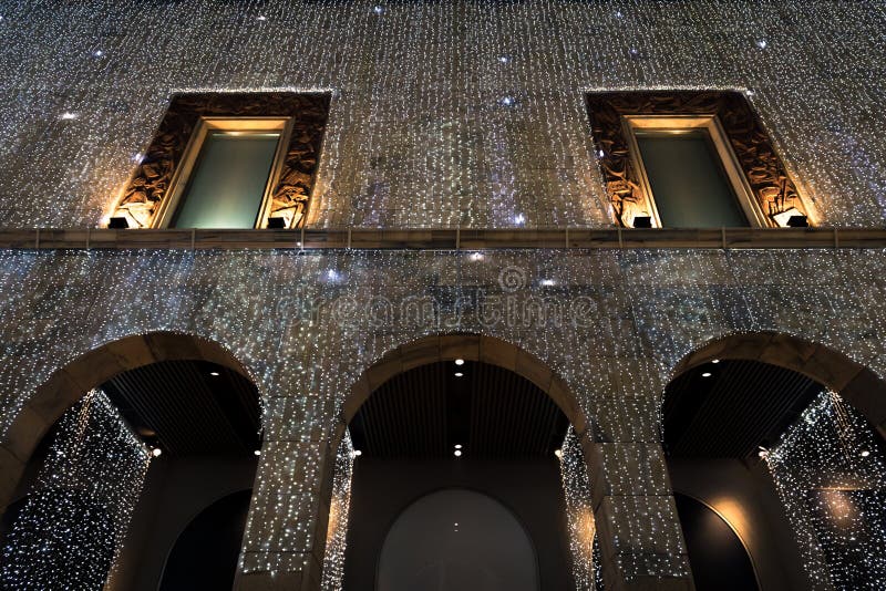 Front View of an Illuminated Building with Christmas Decorations Stock ...