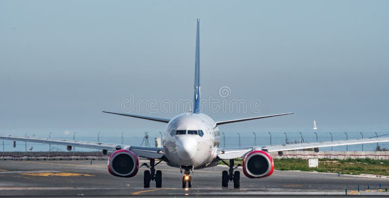 Front View of Jet Plane in the Runway with Text Space Stock Photo ...