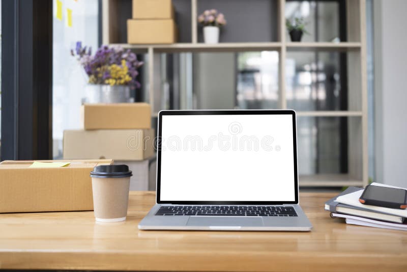 Front View Laptop Computer, Coffee Cup and Cardboard Boxes on Wooden ...