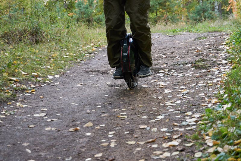 Front View of Male Legs on a Unicycle in the Forest Stock Image - Image ...