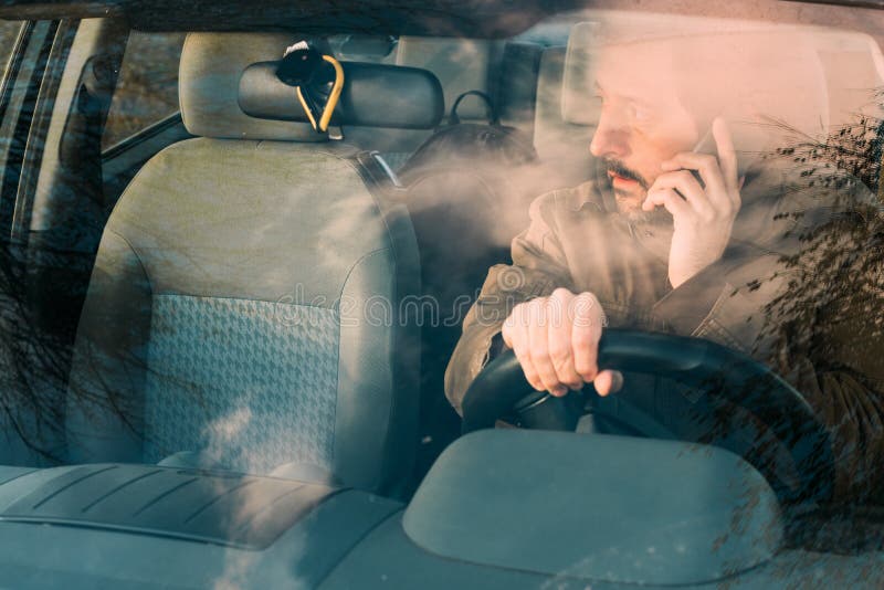 Front View of Man Driving Car and Talking on Mobile Stock Photo - Image ...