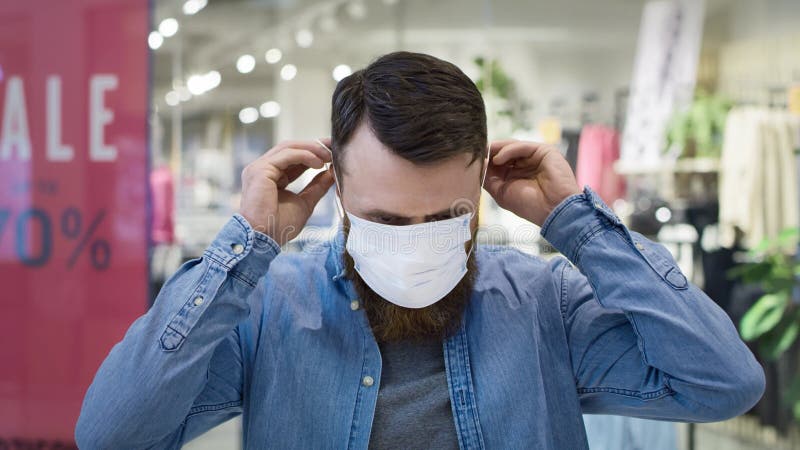 Front View of Man Putting a Protective Face Mask. Stock Video - Video ...