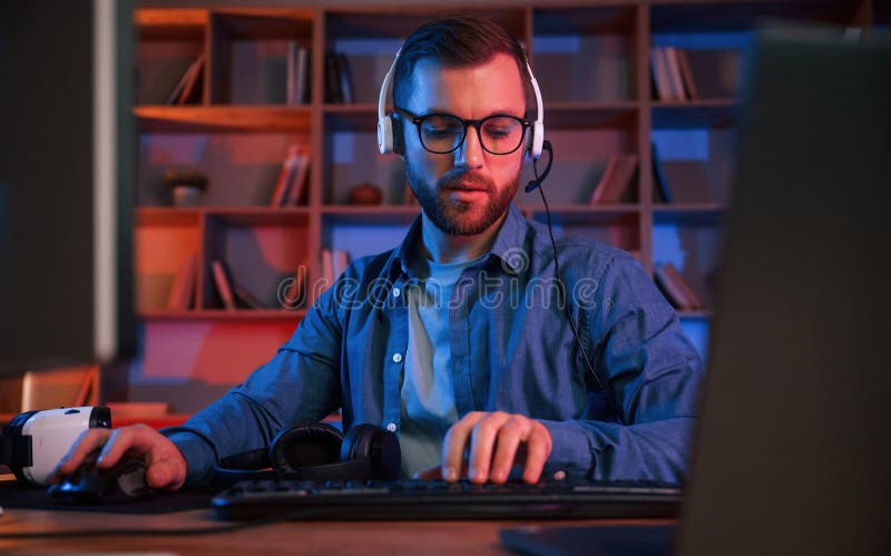 Front View. Man is Sitting by a Computer Indoors at Home Stock Photo ...