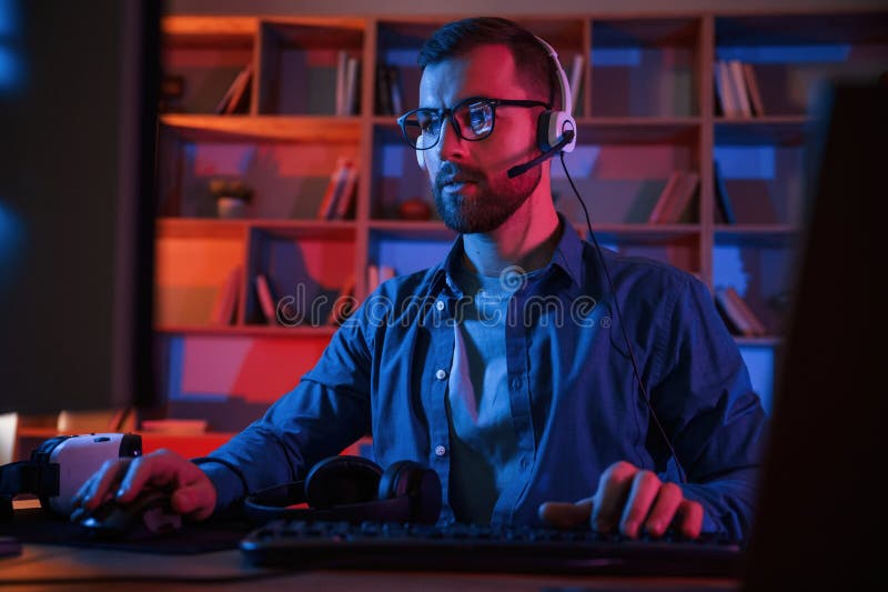 Front View. Man is Sitting by a Computer Indoors at Home Stock Photo ...