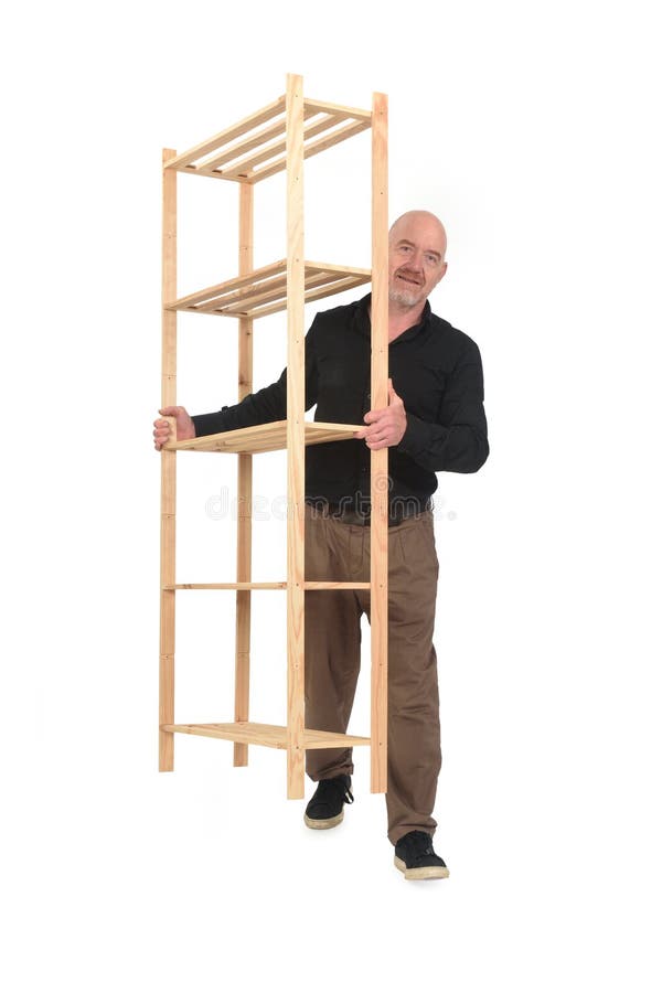 Two Men Carrying Shelf stock photo. Image of furniture - 222462788