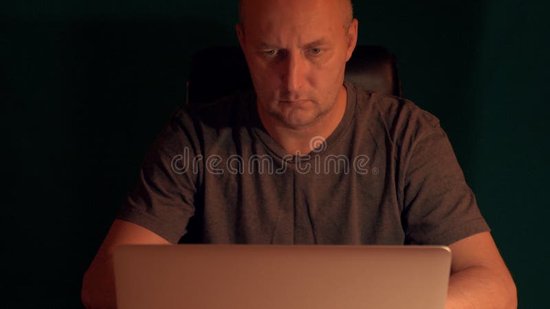 Front View Man Working on Laptop at Night. Low Key Dark Background. Man ...