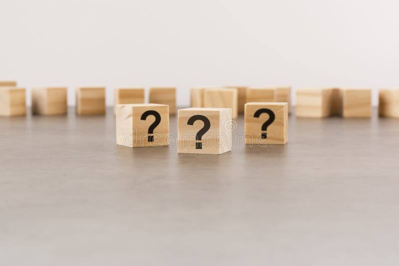 Front View on Many Wood Cubes with Question Marks. Many Question ...