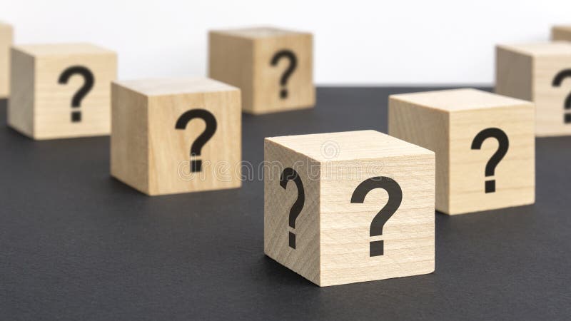 Front View on Many Wood Cubes with Question Marks. Many Question ...