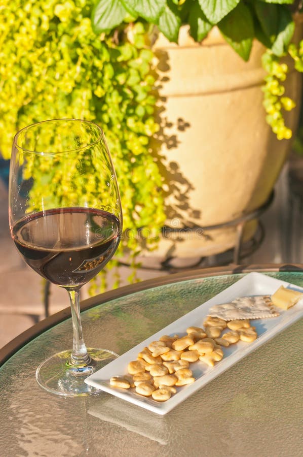 Glass of Expensive, French, Red Wine with a Rectangular, White Plate ...