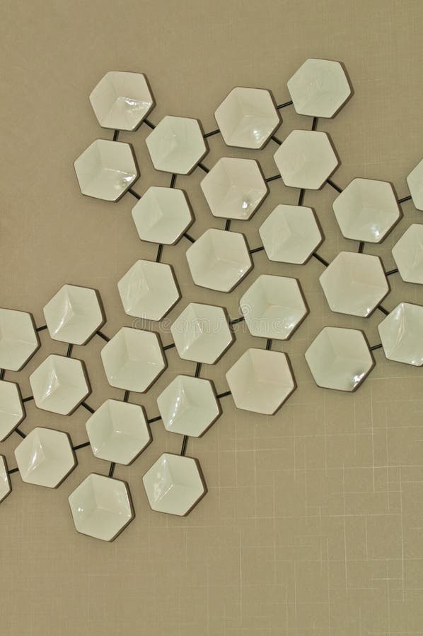 Tan Ceramic Five Sided Objects Connected by Black Rods Stock Image ...