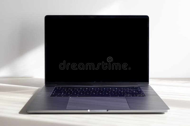 Front View of Modern Laptop with Empty Black Screen on Minimalist Desk ...