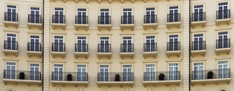 Front View of a Modern Residential Brown Brick Building with Balconies ...