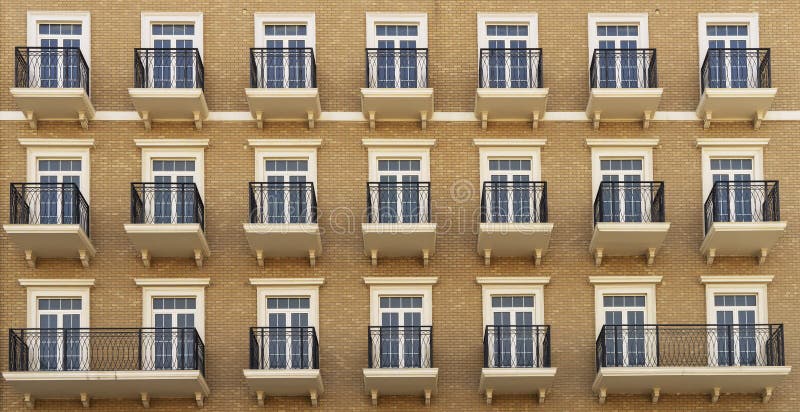 Front View of a Modern Residential Brown Brick Building with Balconies ...