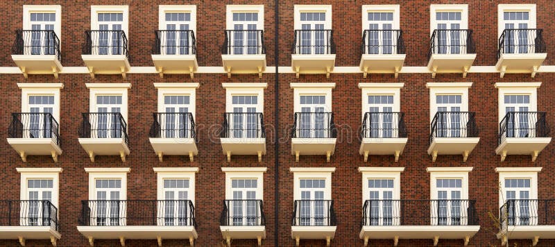 Front View of a Modern Residential Brown Brick Building with Balconies ...