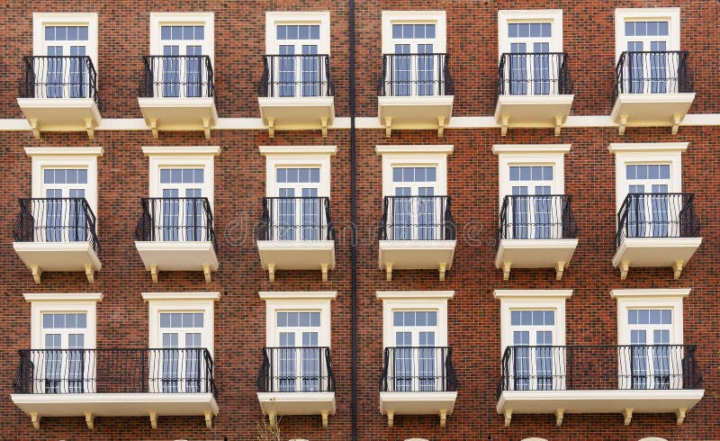 Front View of a Modern Residential Brown Brick Building with Balconies ...