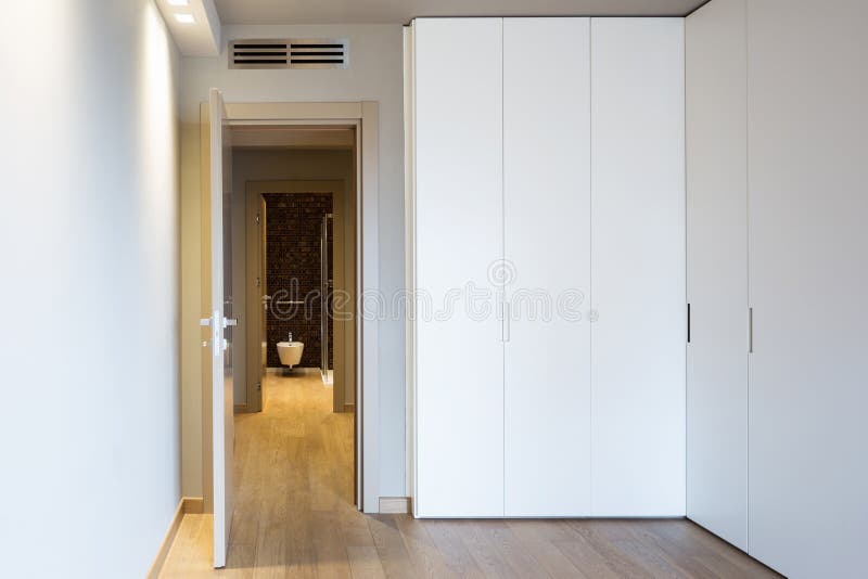 Front View of Modern Room with Large Wardrobe Stock Photo - Image of ...