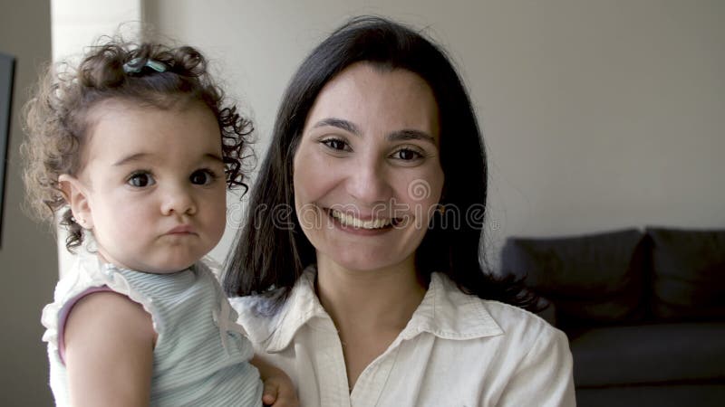 Front View of Mom and Infant Looking at Camera and Smiling. Stock ...