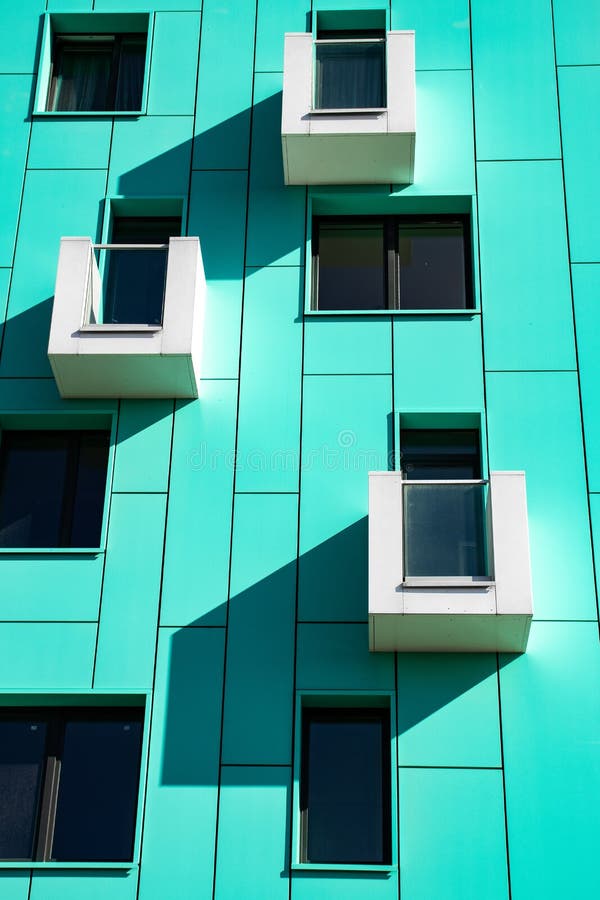 Front View of a Multi-storey Green Modern Building with Small Balconies ...