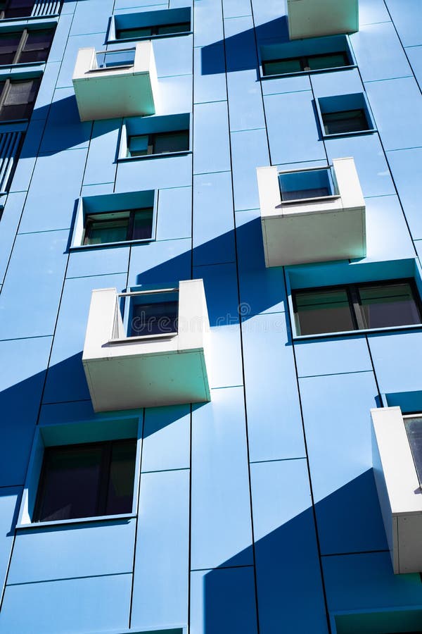 Front View of a Multi-storey Green Modern Building with Small Balconies ...