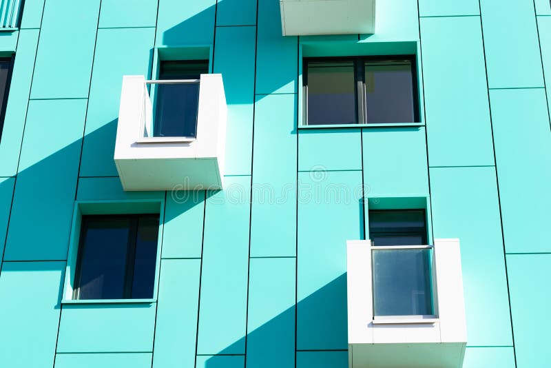 Front View of a Multi-storey Green Modern Building with Small Balconies ...