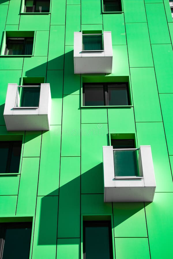 Front View of a Multi-storey Green Modern Building with Small Balconies ...