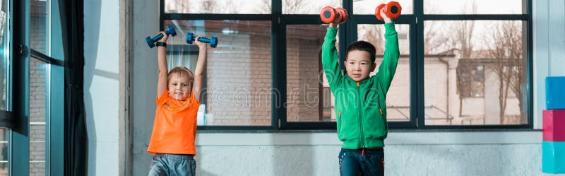 Front View of Multicultural Kids Raising Stock Photo - Image of ...