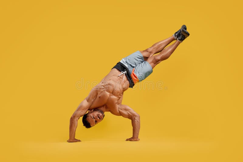 Athletic Young Man Performing Handstand Stunt Stock Photo - Image of ...