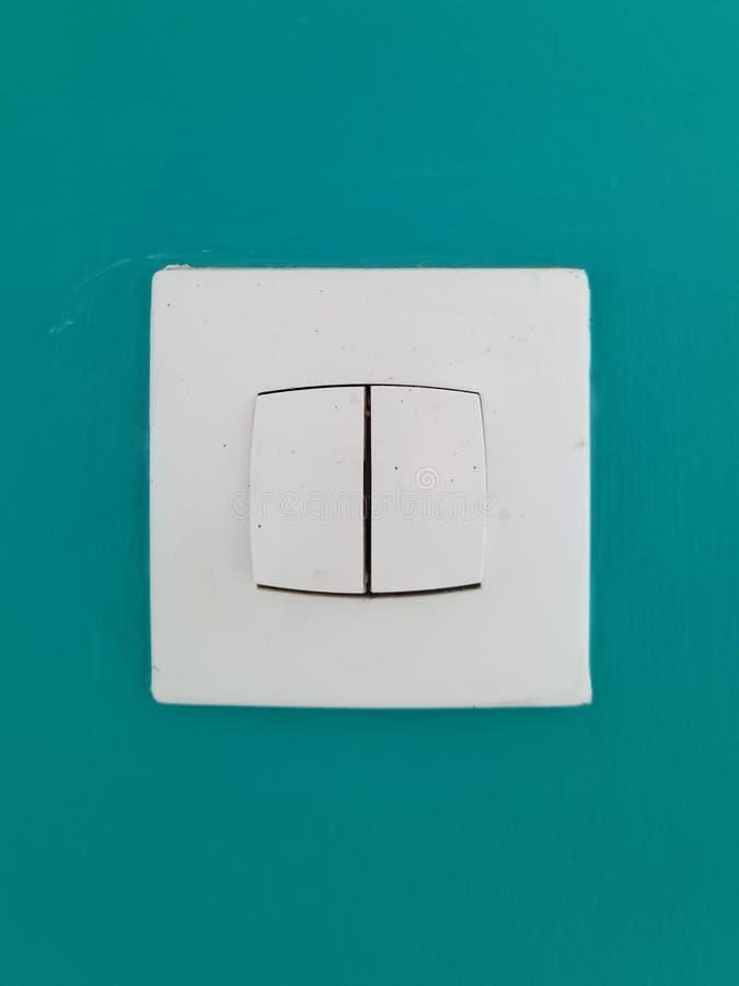 Front View of Old White Antique Light Switch on Green Background. Close ...