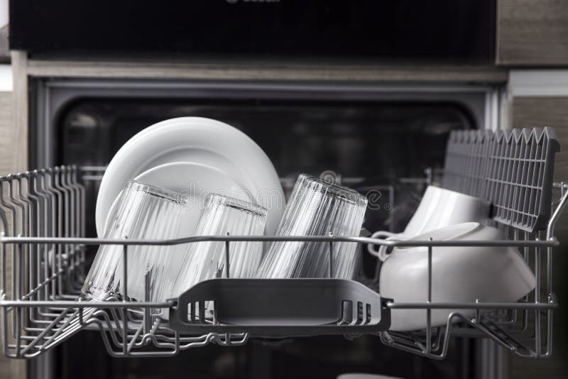 Open Dishwasher with Clean Utensil Inside, Cutlery, Glasses, Dishes at ...