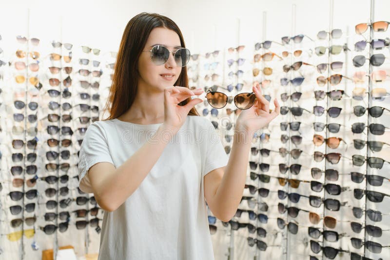 Front View of Optician Holding Sunglasses Pairs Stock Image - Image of ...