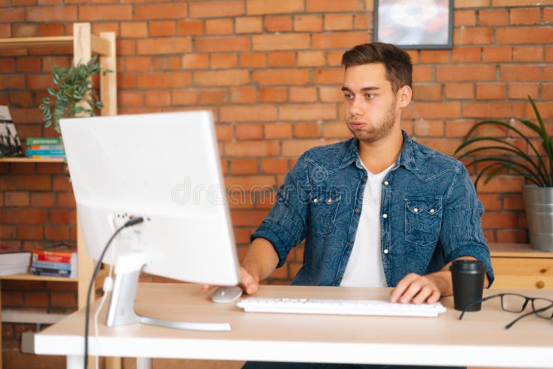 Front View of Overworked Bored Young Freelance Programmer Working on ...