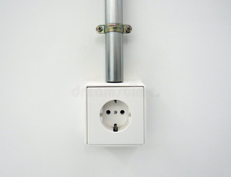 Front View of Plug on White Wall and Metal Tube. Industrial and Modern ...