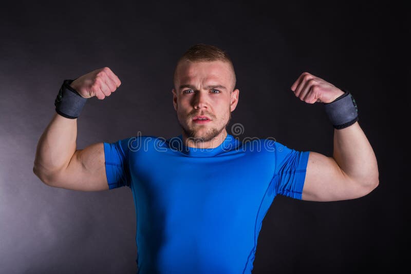 Front View Portrait of a Angry Man Standing Showing His Muscles Over ...