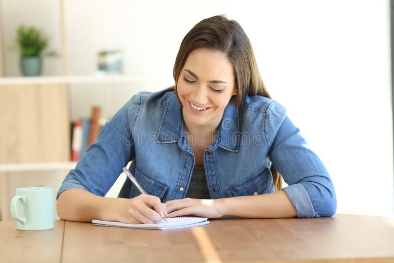 Woman Writing in a Notebook on a Table Stock Photo - Image of idea ...