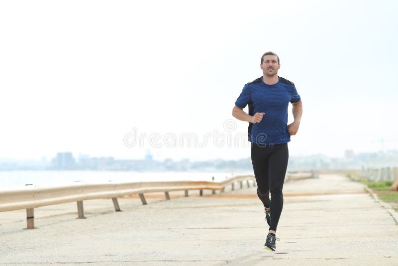 Front View of Runner Running on the Beach Stock Image - Image of ...