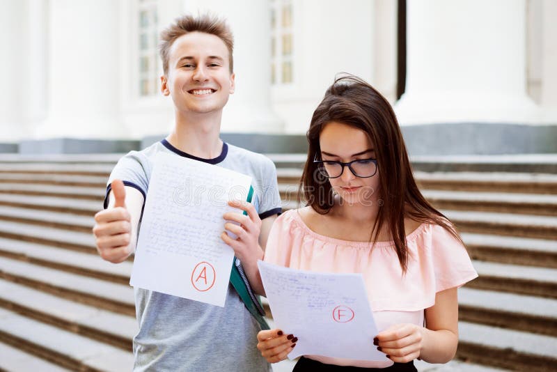Portrait of Two Students Showing Failed and Approved Exams Stock Image ...