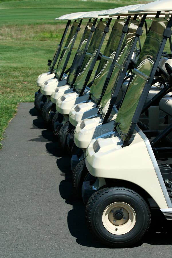 Front View of a Row of Golf Carts Stock Image - Image of grass, tires ...