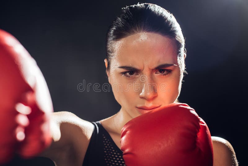 Front View of Serious Boxer in Red Boxing Gloves Looking at Camera on ...